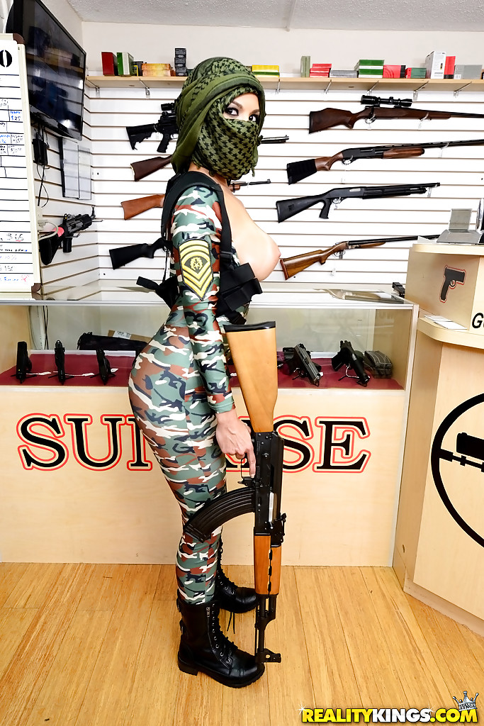 Camouflaged Chick With Rifle In Hand Lets Her Big Natural Breasts Loose